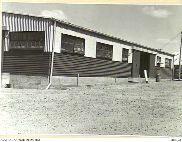 REDBANK, QUEENSLAND. 1945-04-04. THE EXTERIOR OF A RE TINNING SHED AT 2 ...