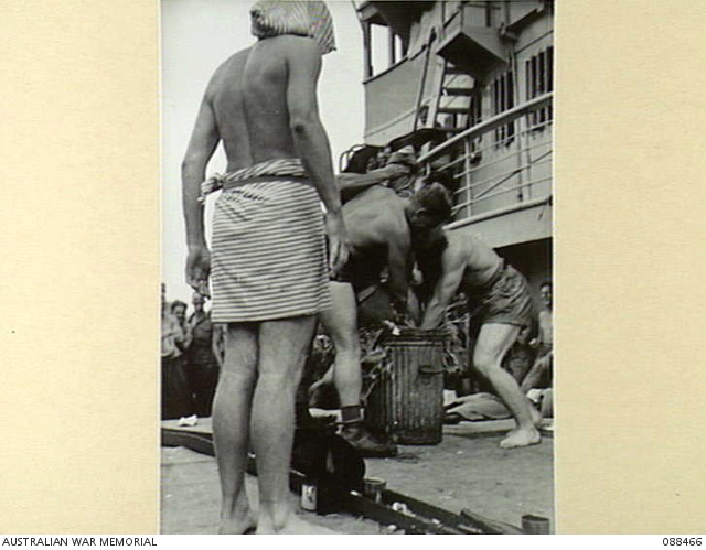 AT SEA. 1945-04-07. SERGEANT T. CAIN, 9 DIVISION PROVOST COMPANY, IS ...