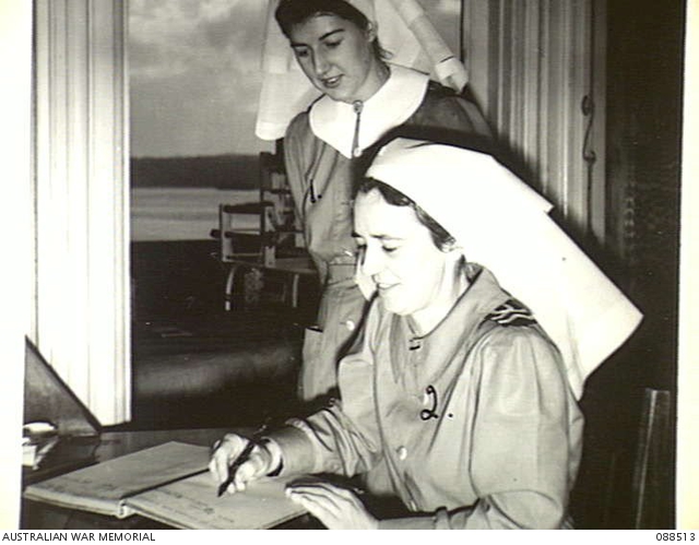 Informal portrait of Superintendent Sister Mabel Lucy Rae at her desk ...