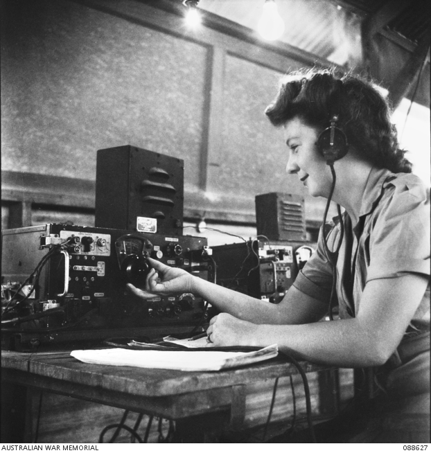 KATHERINE, NORTHERN TERRITORY. 1945-04. SIGNALWOMAN N. OVEREND TUNING A ...