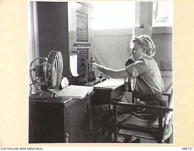DARWIN, NT. 1945-04-14. A MEMBER OF THE AUSTRALIAN WOMEN'S ARMY SERVICE ...