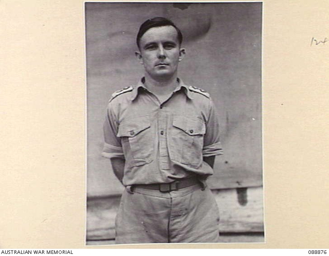 ATHERTON, QUEENSLAND. 1945-05. CAPTAIN CONNELLY AT HEADQUARTERS 7 ...