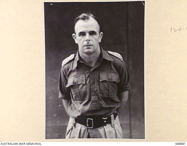 ATHERTON, QUEENSLAND. 1945-05. CAPTAIN MOORE AT HEADQUARTERS 7 DIVISION ...