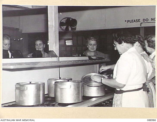 SYDNEY, NSW. 1945-04-18. VOLUNTARY WORKERS PREPARING MEALS IN THE ...