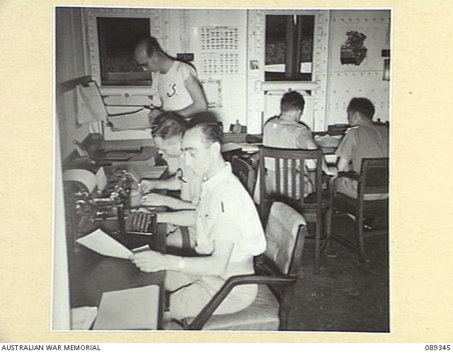 AT SEA, OFF QUEENSLAND, 1945-05-03. IN THE VICTUALLING OFFICE ABOARD ...