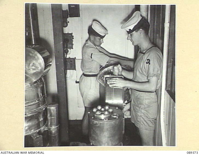 AT SEA, 1945-05-04. ABLE SEAMAN E.V. GAFFY, (1), AND ABLE SEAMAN F.A ...