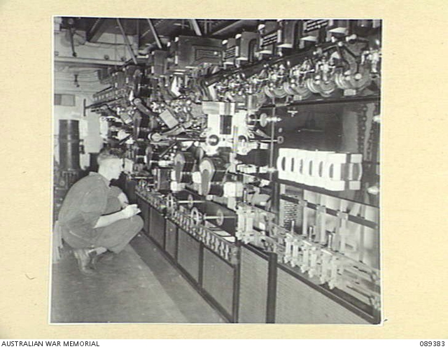 AT SEA, 1945-05-04. A WATCHKEEPING ENGINE ROOM ARTIFICER ON DUTY AT THE ...