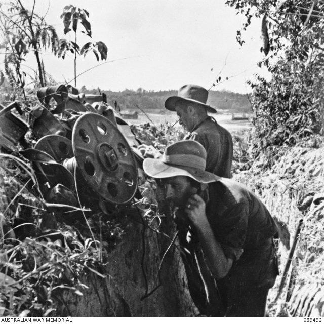 TARAKAN, BORNEO, 1945-05-05. GUNNER H.A. KERS, (1), AND GUNNER J.J ...