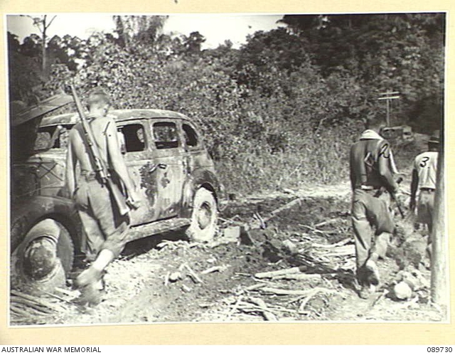 TARAKAN, BORNEO, 1945-05-13. TROOPER L.H. RUMBOLD, (1), AND CAPTAIN N.T ...