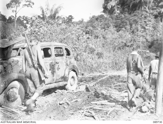 TARAKAN, BORNEO, 1945-05-13. TROOPER L.H. RUMBOLD, (1), AND CAPTAIN N.T ...