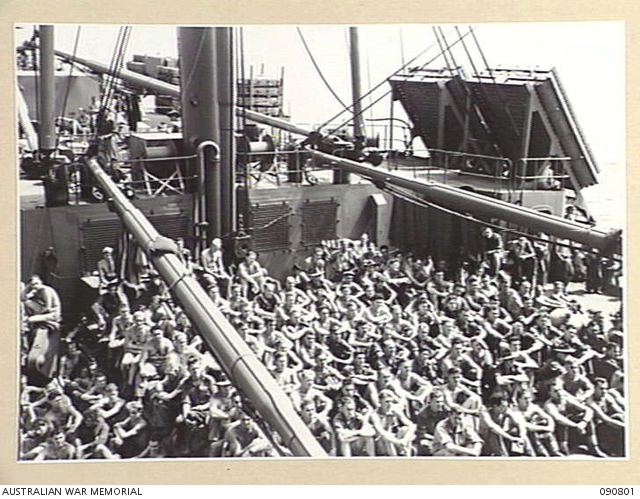 AT SEA, TOWNSVILLE-MOROTAI. 1945-04-15. TROOPS ATTENDING THE MEMORIAL ...