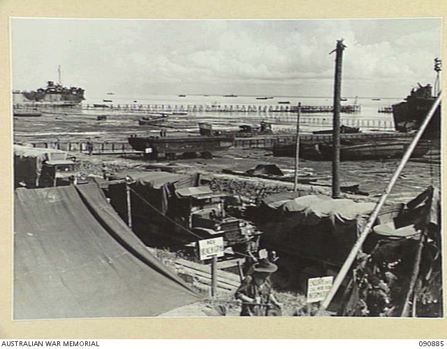 TARAKAN, BORNEO. 1945-05-01. RED 2 BEACH WITH THE OIL JETTY IN THE ...