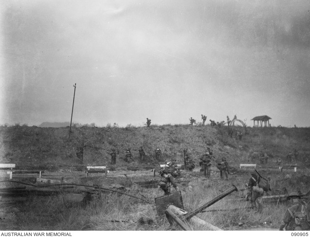 TARAKAN, BORNEO. 1945-05-01. TROOPS OF 2/23 INFANTRY BATTALION CLIMBING ...
