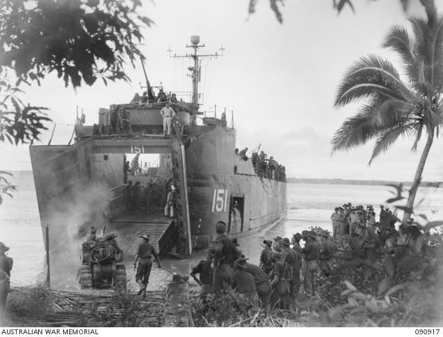 SADAU ISLAND, BORNEO. 1945-04-30. EQUIPMENT COMING OFF LANDING CRAFT ...