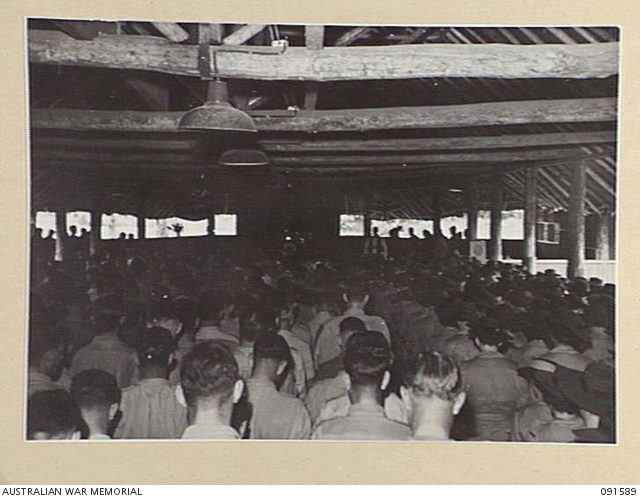 LAE, NEW GUINEA, 1945-05-09. HEADQUARTERS FIRST ARMY PERSONNEL STAND ...
