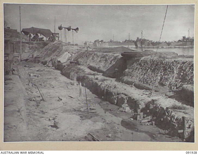 TARAKAN, BORNEO. 1945-05-08. LOOKING SOUTHEAST ALONG A TANK DITCH AT ...