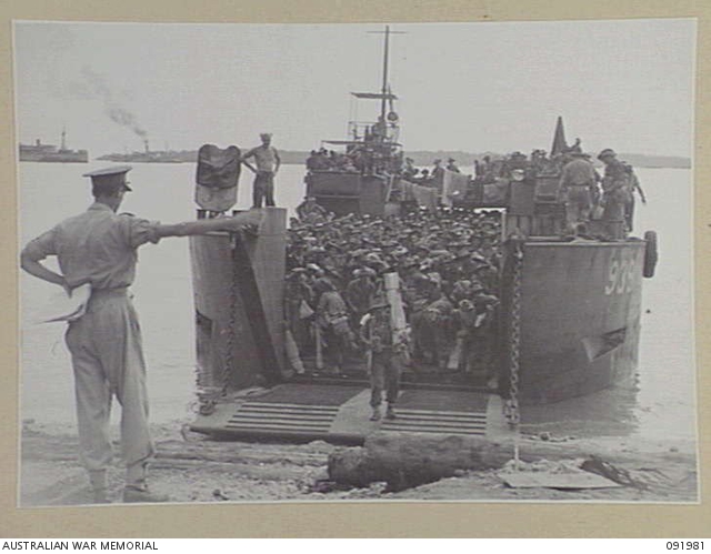 MOROTAI ISLAND, 1945-05-13. A LANDING CRAFT WITH RAMP DROPPED, PULLING ...