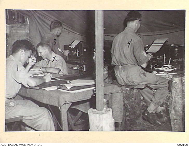 MOROTAI, 1945-05-15. TROOPS WORKING IN THE CIPHER OFFICE, A CORPS SIGNALS, HEADQUARTERS 1 CORPS ...