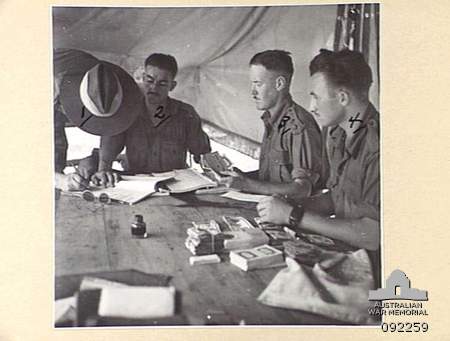 MOROTAI, 1945-05-17. LANCE-CORPORAL P.G. GURSANSCKY (1), SIGNING THE ...