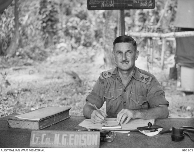BOUGAINVILLE, 1945-06-18. LT-COL M.G. EDISON, WORKING IN HIS OFFICE AT ...