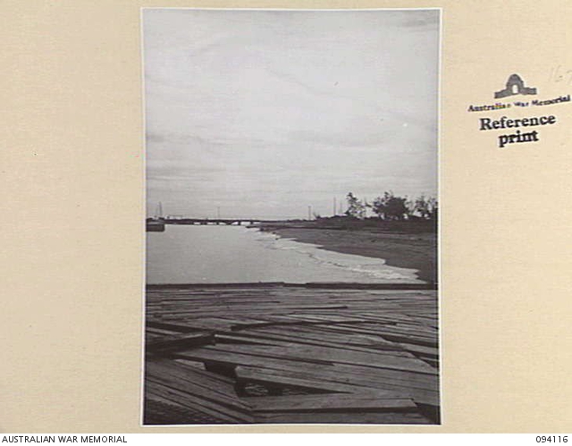 BUNA, NEW GUINEA, 1945-07-03 TO 1945-07-04. THE RUINS OF THE DOCKS AT ...