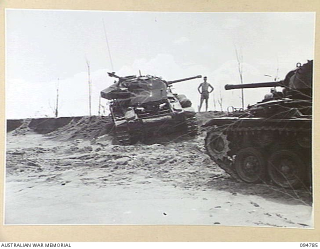 TOROKINA AREA, BOUGAINVILLE, 1945-08-06. A DISABLED M24 GENERAL CHAFFEE ...