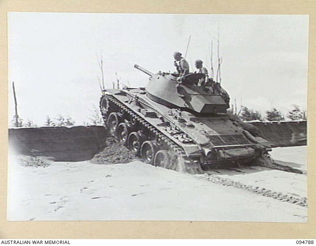 TOROKINA AREA, BOUGAINVILLE, 1945-08-06. AN M24 GENERAL CHAFFEE LIGHT ...