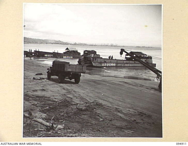 BORAM BEACH, NEW GUINEA. 1945-08-06. A GENERAL VIEW OF TRUCKS OF ...