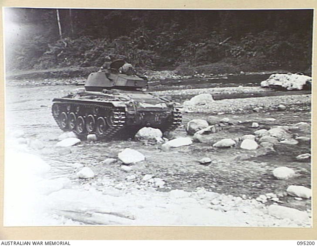 TOROKINA, BOUGAINVILLE, 1945-08-14. AN M24 LIGHT TANK FORDING AND ...