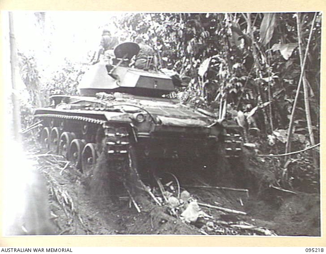 TOROKINA AREA, BOUGAINVILLE, 1945-08-14. AN M24 LIGHT TANK TOPPING THE ...