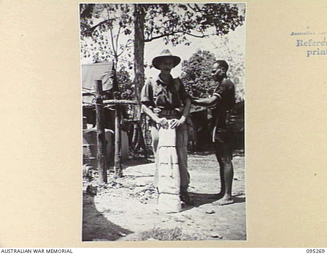 PALMALMAL, JACQUINOT BAY, NEW BRITAIN, 1945-08-13. A MEMBER OF THE ...