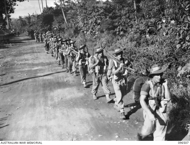 RABAUL, NEW BRITAIN, 1945-09-11. TROOPS OF 22 INFANTRY BATTALION MOVING ...