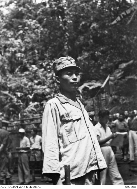 KUMUIA YAMA, RABAUL AREA, NEW BRITAIN. 1945-09-17. A CHINESE SENTRY ...