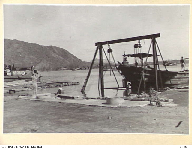 RABAUL, NEW BRITAIN. 1945-10-12. WHILE THE JAPANESE REPAIR ONE OF THEIR ...