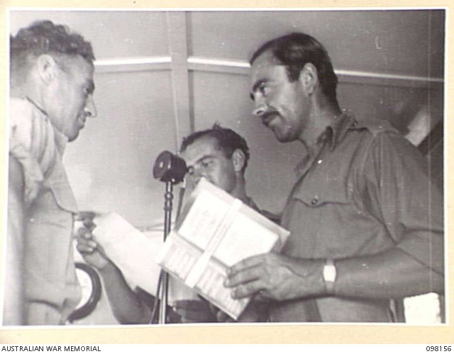 WEWAK POINT, NEW GUINEA. 1945-10-23. SERGEANT N. BRAY (3) ASKING ...