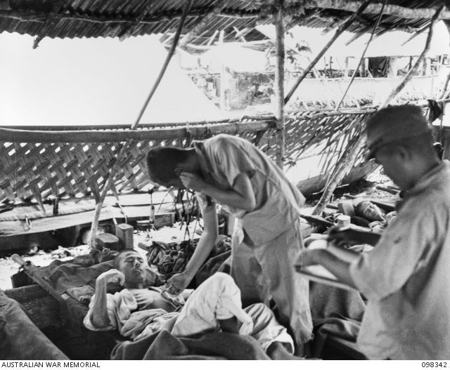 MUSCHU ISLAND, NEW GUINEA. 1945-10-27. JAPANESE DOCTOR EXAMINING A ...