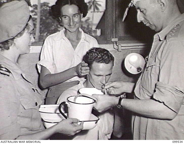 RABAUL, NEW BRITAIN, 1945-12-22. CAPTAIN T. L. JOBBIN, MEDICAL OFFICER ...