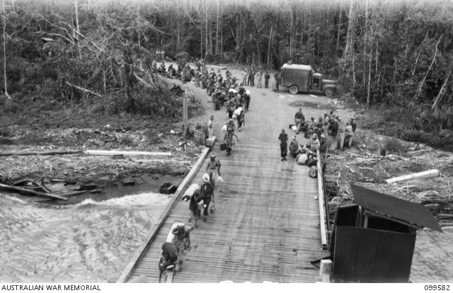 LAE, NEW GUINEA, 1945-11-20. TROOPS OF LAE BASE SUB AREA MAKING THEIR ...