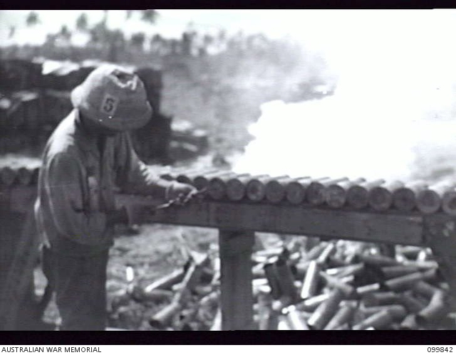 RABAUL, NEW BRITAIN, 1946-02-19. A JAPANESE EXPLODING THE PRIMERS OF 3 ...