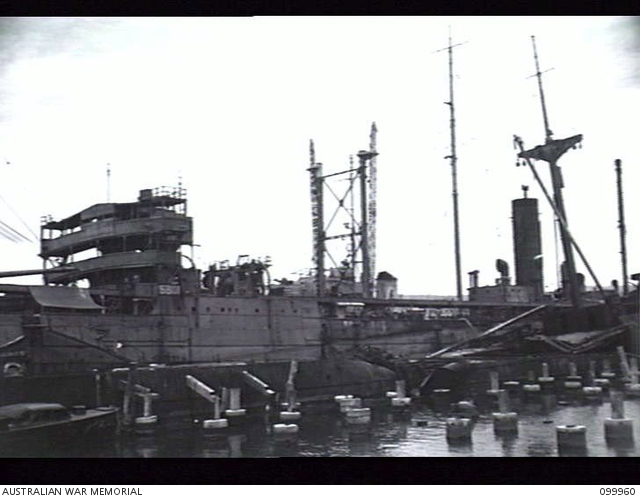 RABAUL, NEW BRITAIN, 1946-04-04. A JAPANESE CARGO SHIP AT NAVAL HQ ...