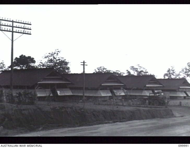 RABAUL, NEW BRITAIN, 1946-04-13. THE CAMP ADMINISTRATION BUILDINGS AT ...