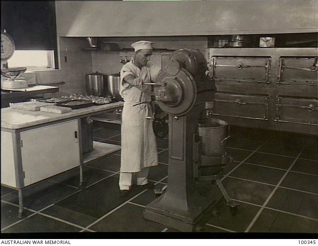 Concord, NSW. c. 1944-03-04. The kitchen bakehouse where the cook is ...