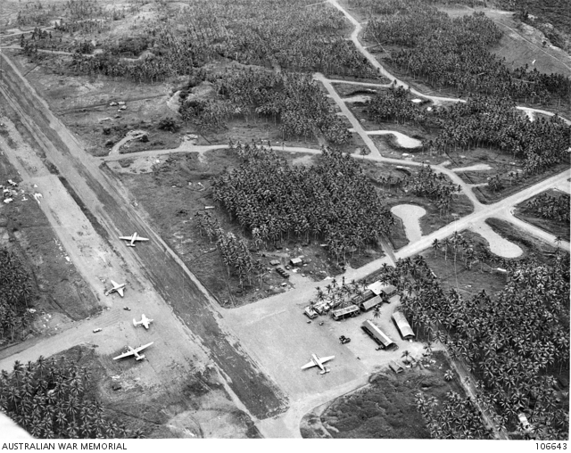 Milne Bay. Aircraft lined up on Gurney Airfield surrounded by trees. The airstrip is one of the ...