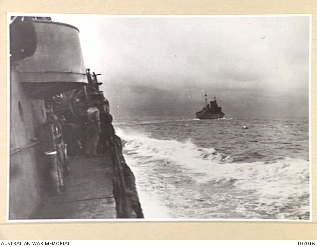 1944-03. HMAS WARRAMUNGA APPROACHING HMAS AUSTRALIA DURING OPERATIONS ...