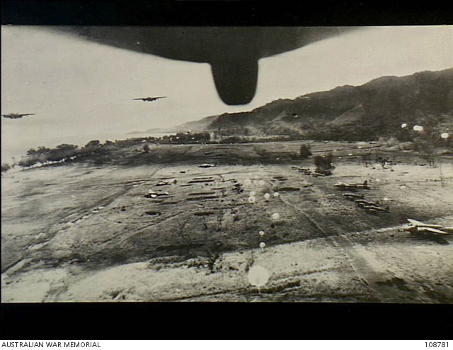DAGUA, NEW GUINEA, 1944-02. PARACHUTE BOMBS BEING DROPPED ON THE ...