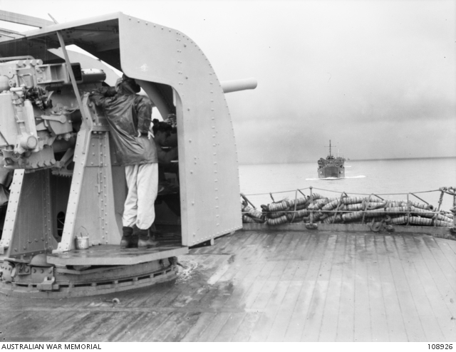 AT SEA, 5 JUNE 1945. A LINE OF LANDING SHIP TANKS MOVING IN LINE BEHIND ...
