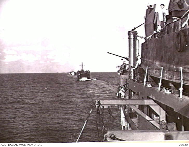 AT SEA, 5 JUNE 1945. A LINE OF LANDING SHIP TANKS MOVING IN LINE BEHIND ...