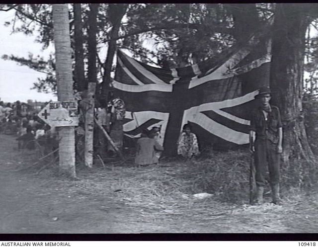 LABUAN ISLAND. 14 JUNE 1945. THE ENTRANCE TO THE BRITISH BORNEO CIVIL ...