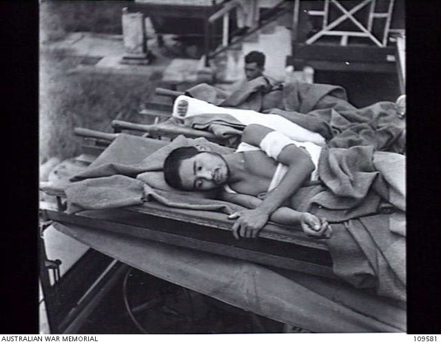 LABUAN ISLAND. 13 JUNE 1945. ONE OF TWO WOUNDED JAPANESE PRISONERS OF ...