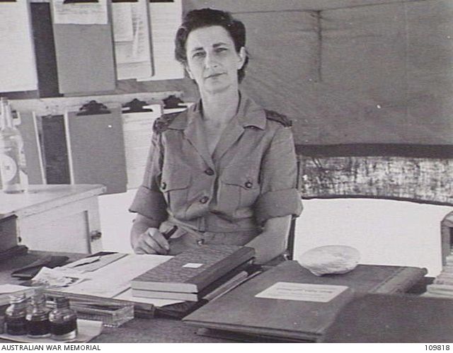 MOROTAI. 16 JUNE 1945. MATRON H CROLL AT THE DESK IN HER TENT AT 2/9 ...
